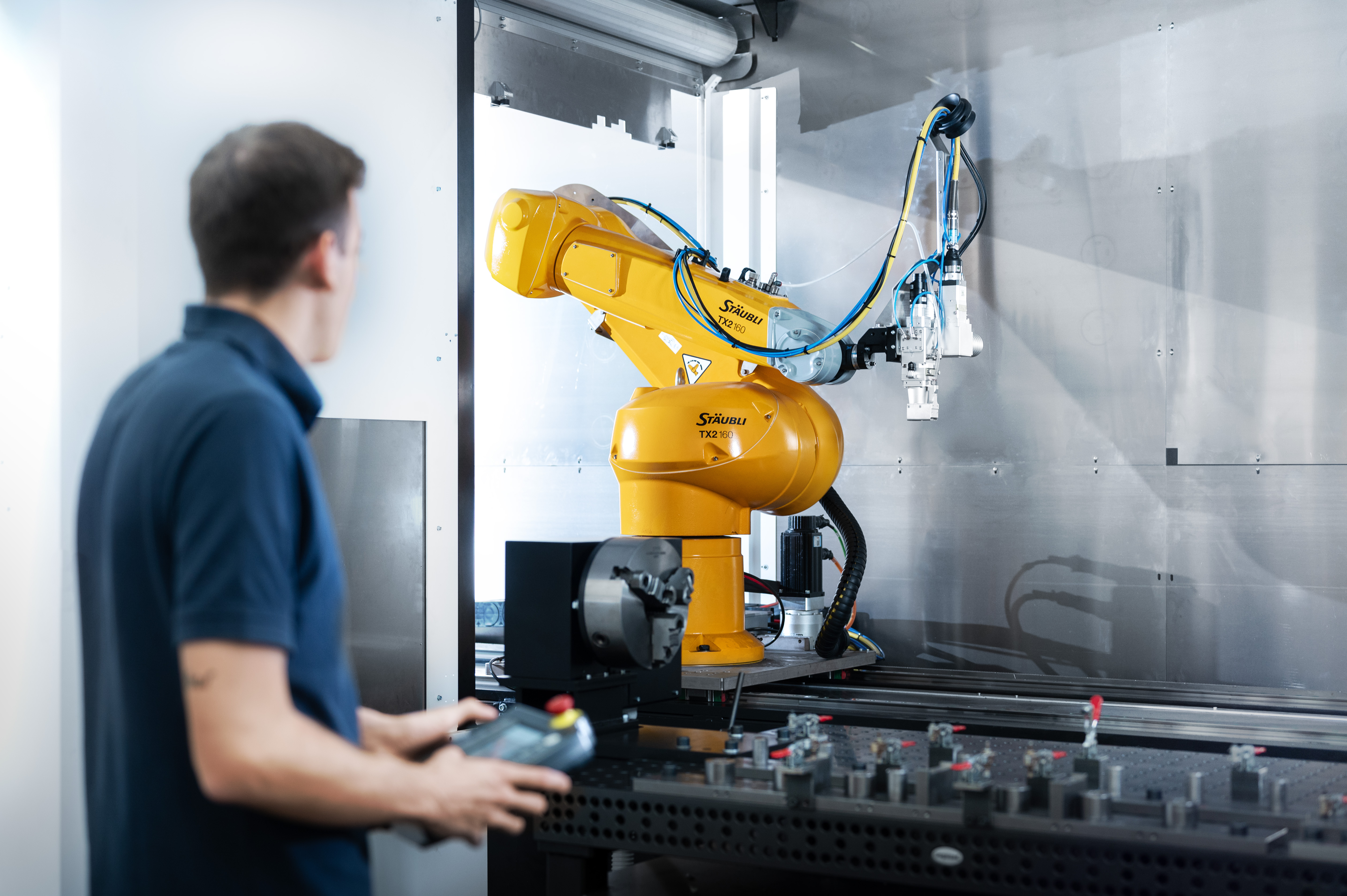 Six axes plus one: One laser welding robot for two cells, Stäubli Tec-Systems GmbH Robotics ...